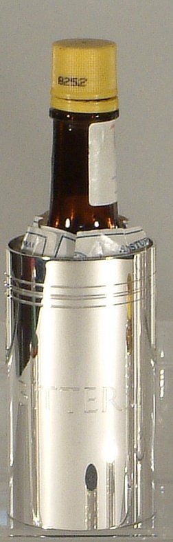 A silver plated bottle holder, especially designed and engraved to hold ...